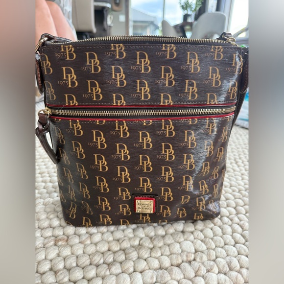 Dooney & Bourke | Bags | Dooney Bourke Logo Patterned Messenger Bag ...